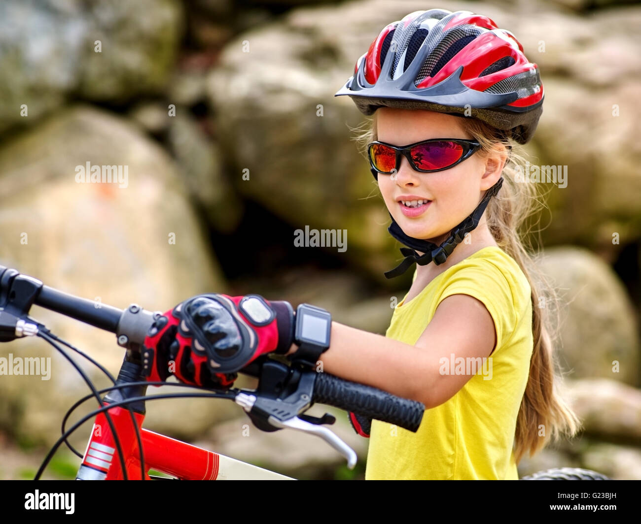 Bikes cycling girl into park. Girl rides bicycle into mountains Stock ...
