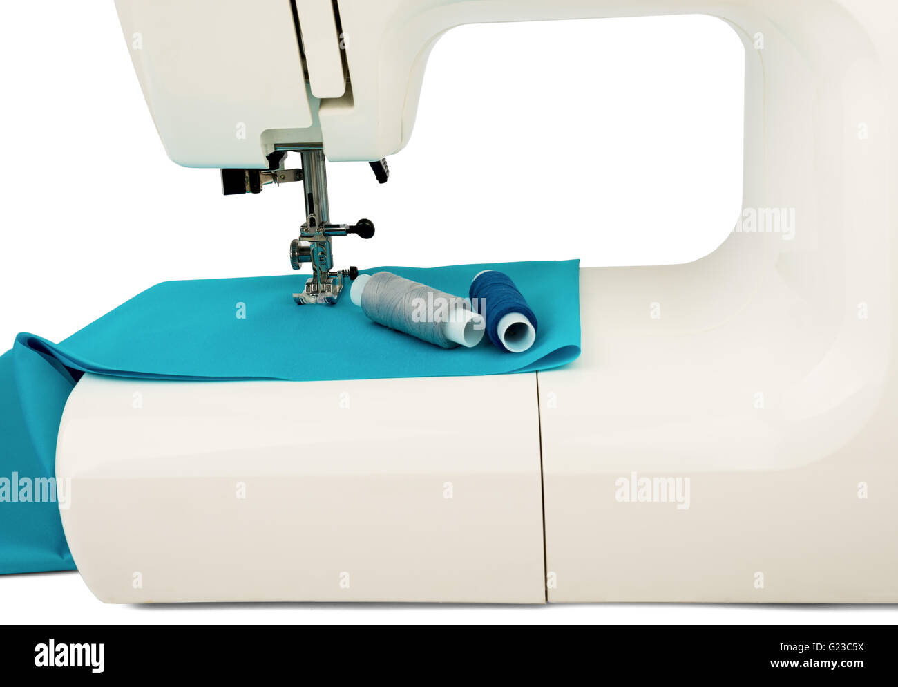 Machine sews with blue textile fabric Stock Photo - Alamy