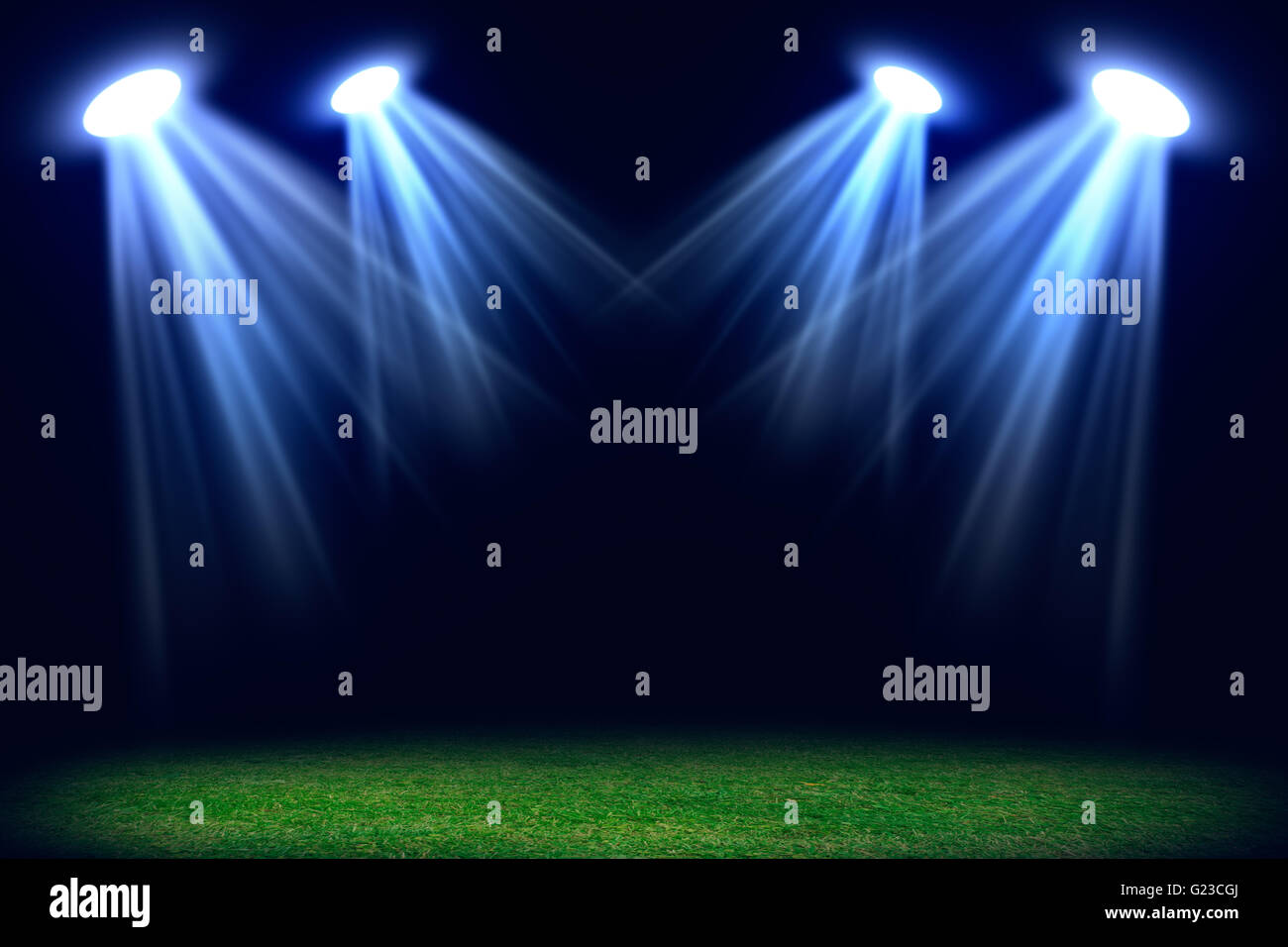 Grass field lit with bright spotlights Stock Photo - Alamy