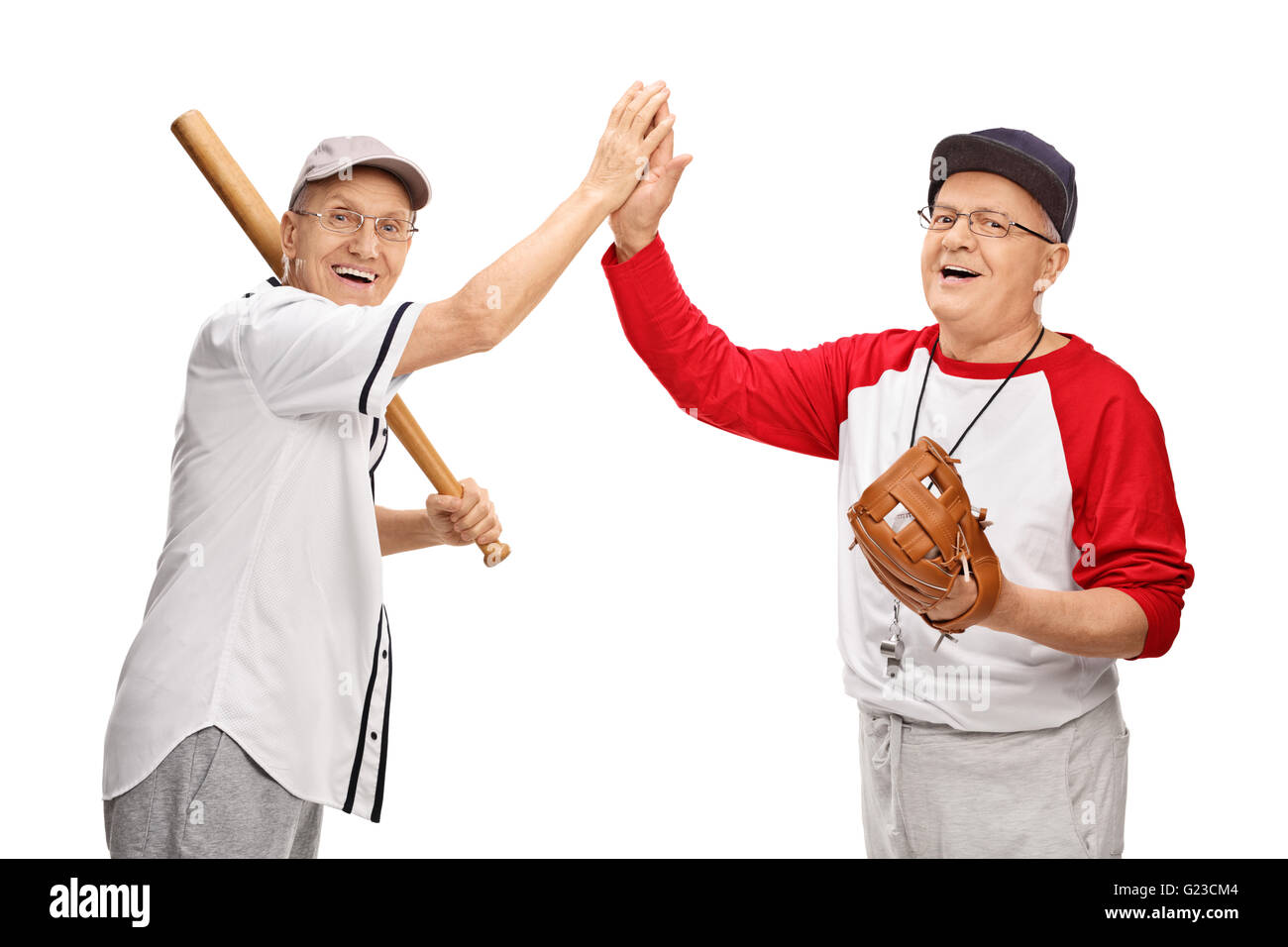 Two seniors in baseball sportswear high-five each other isolated on ...