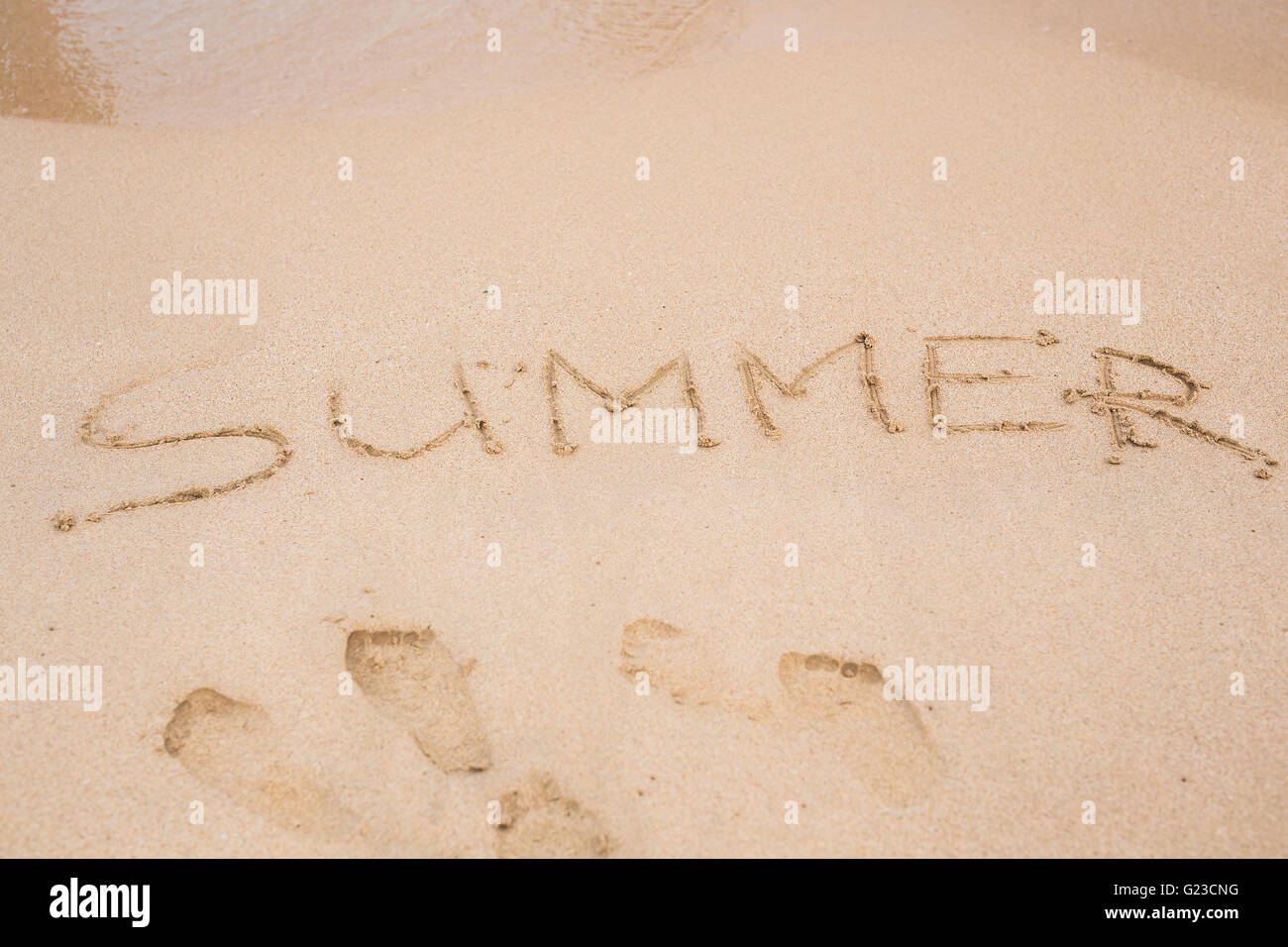 the word summer written in sand Stock Photo - Alamy