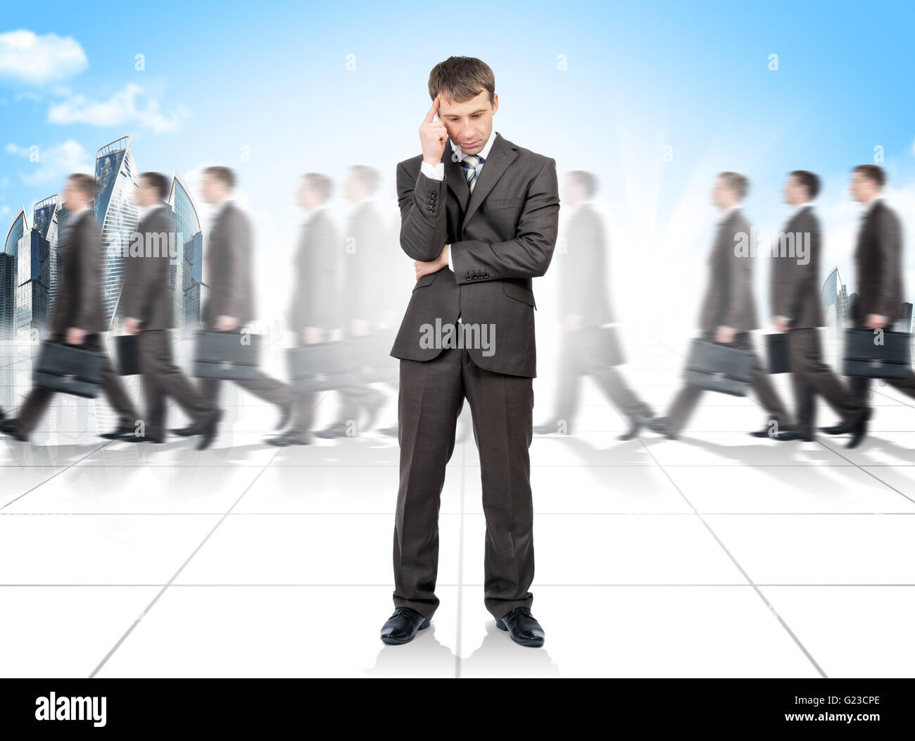 Thinking businessman. Many people on background Stock Photo - Alamy