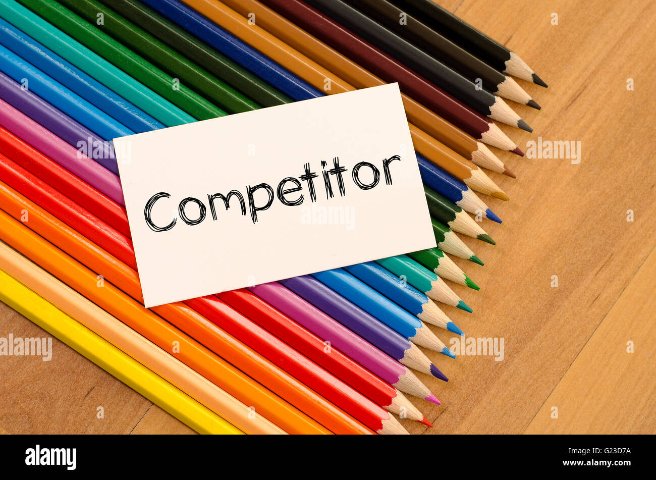 Competitor text concept and colored pencil on wooden background Stock ...