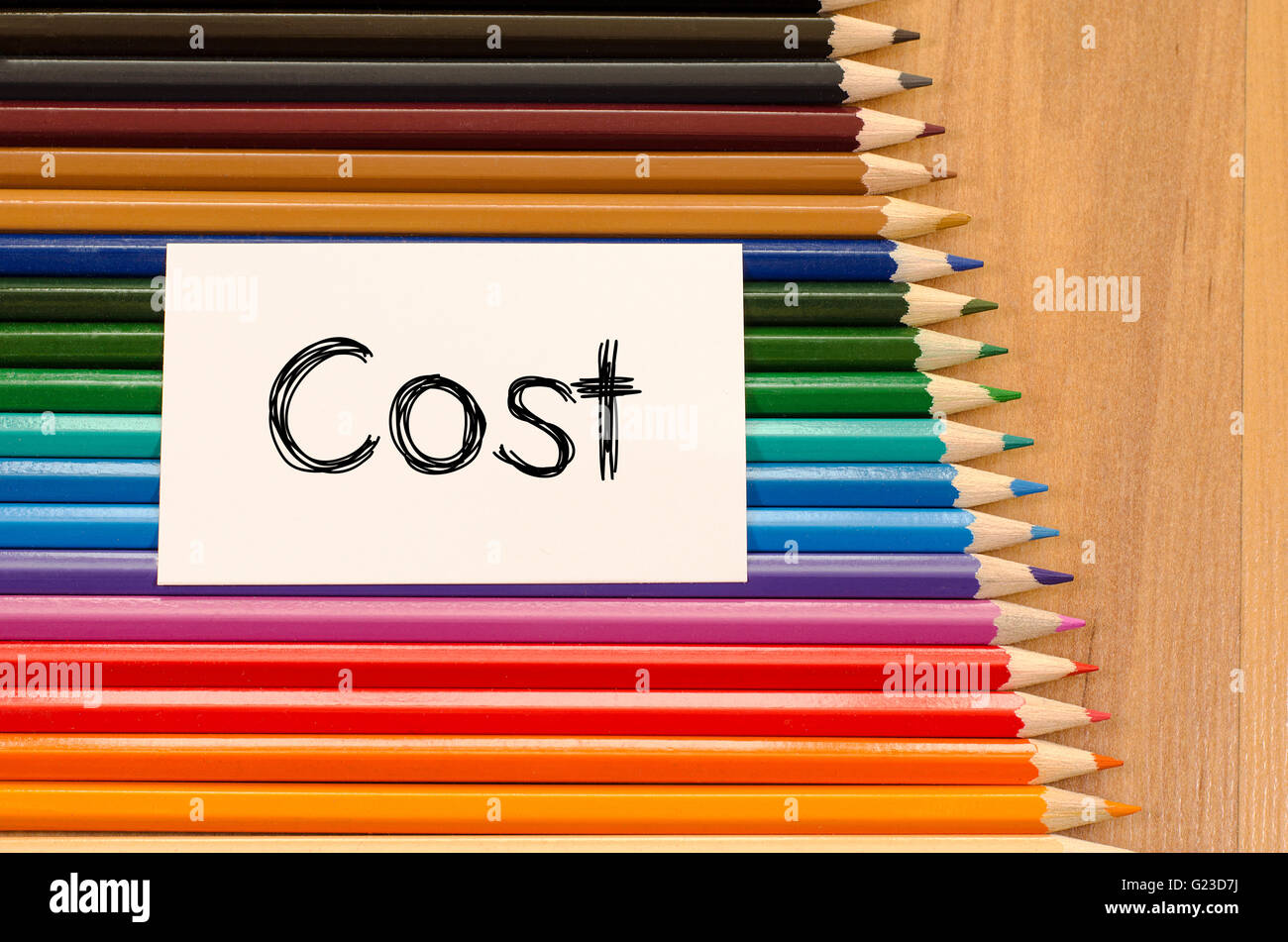 Cost text concept and colored pencil on wooden background Stock Photo ...