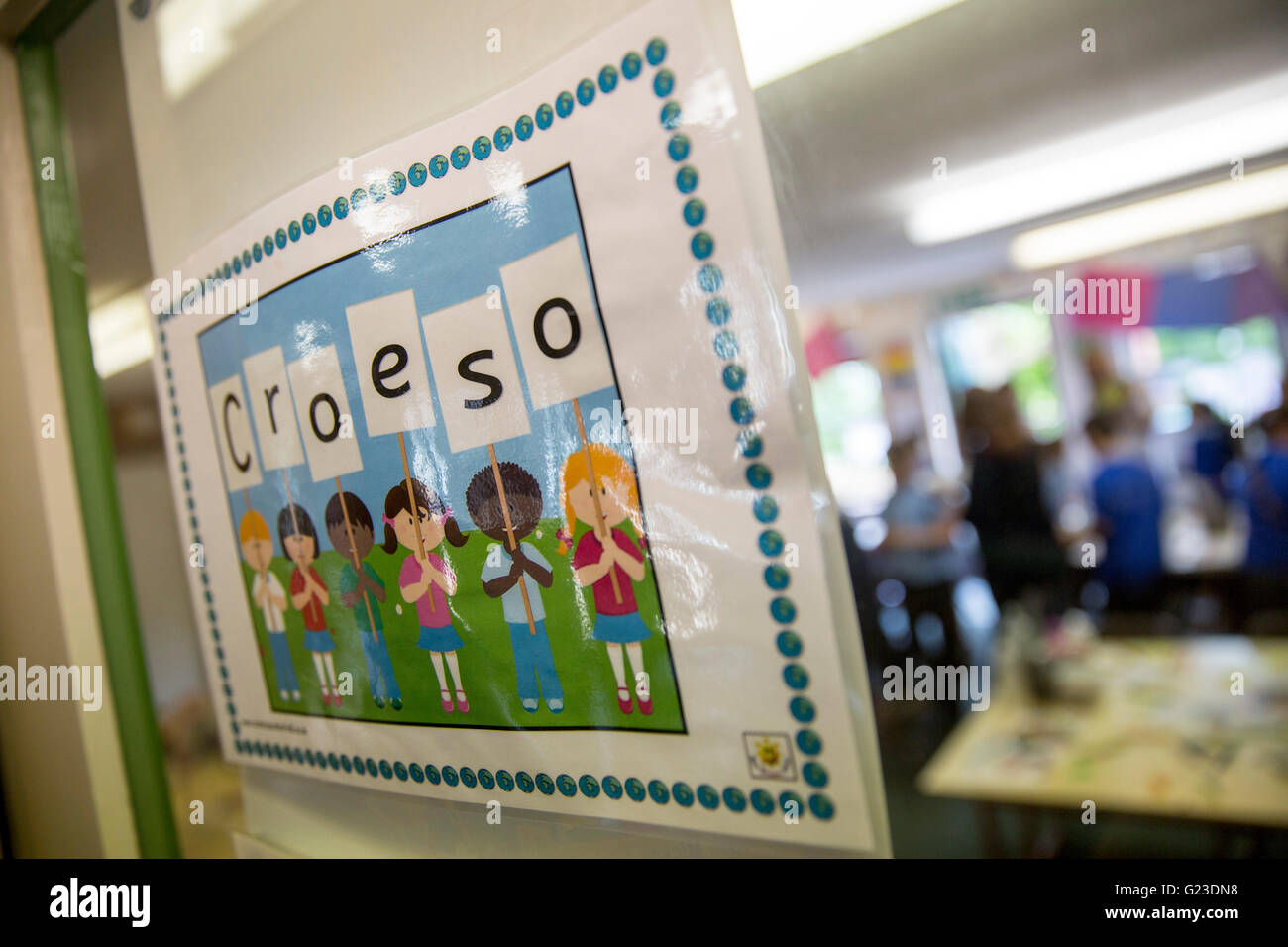 A welcome sign in Welsh on the door of a Welsh primary school Stock ...