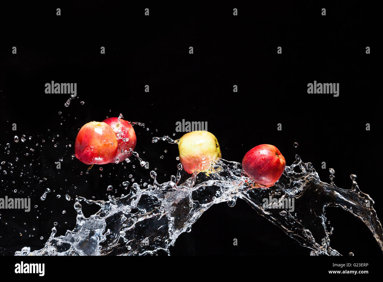 Red apples, flying in space with the water on a black background Stock ...