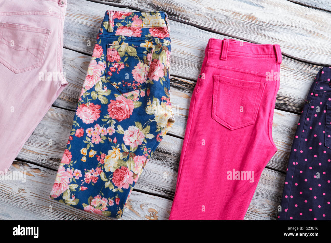 Folded trousers of different color Stock Photo - Alamy