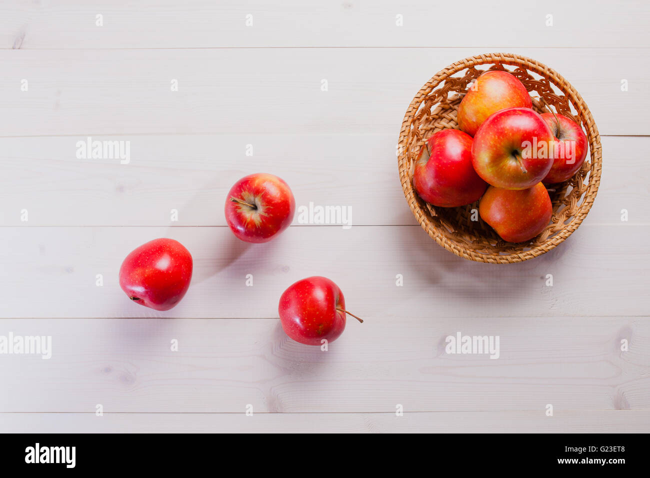 few apples on a white background with the basket Stock Photo - Alamy