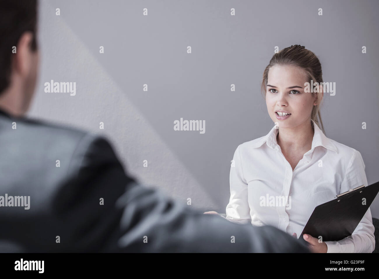 Business woman interviewing business man in modern office Stock Photo ...