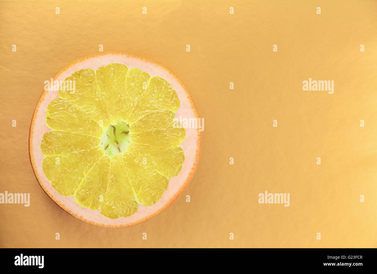 yellow grapefruit on a gold background Stock Photo - Alamy