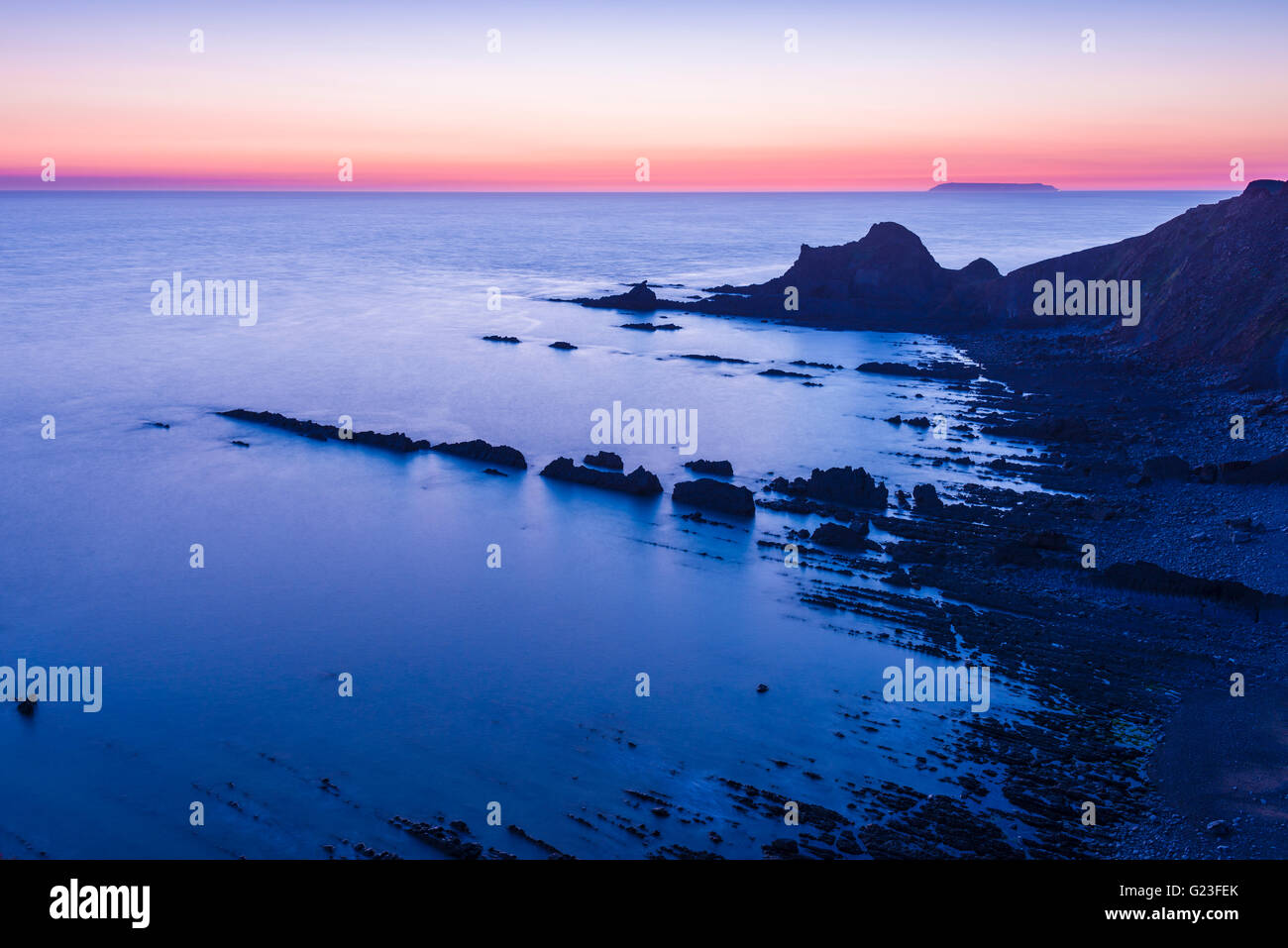 Blegberry Beach at dusk on the North Devon coast with Lundy Island on ...