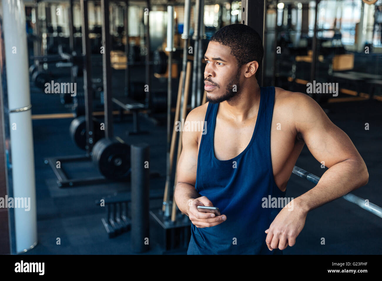 Afro american bodybuilder guy collecting his thoughts after a workout ...