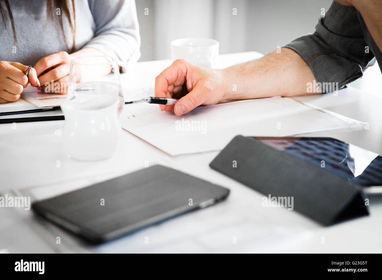 working with notepad and tablet computer Stock Photo - Alamy