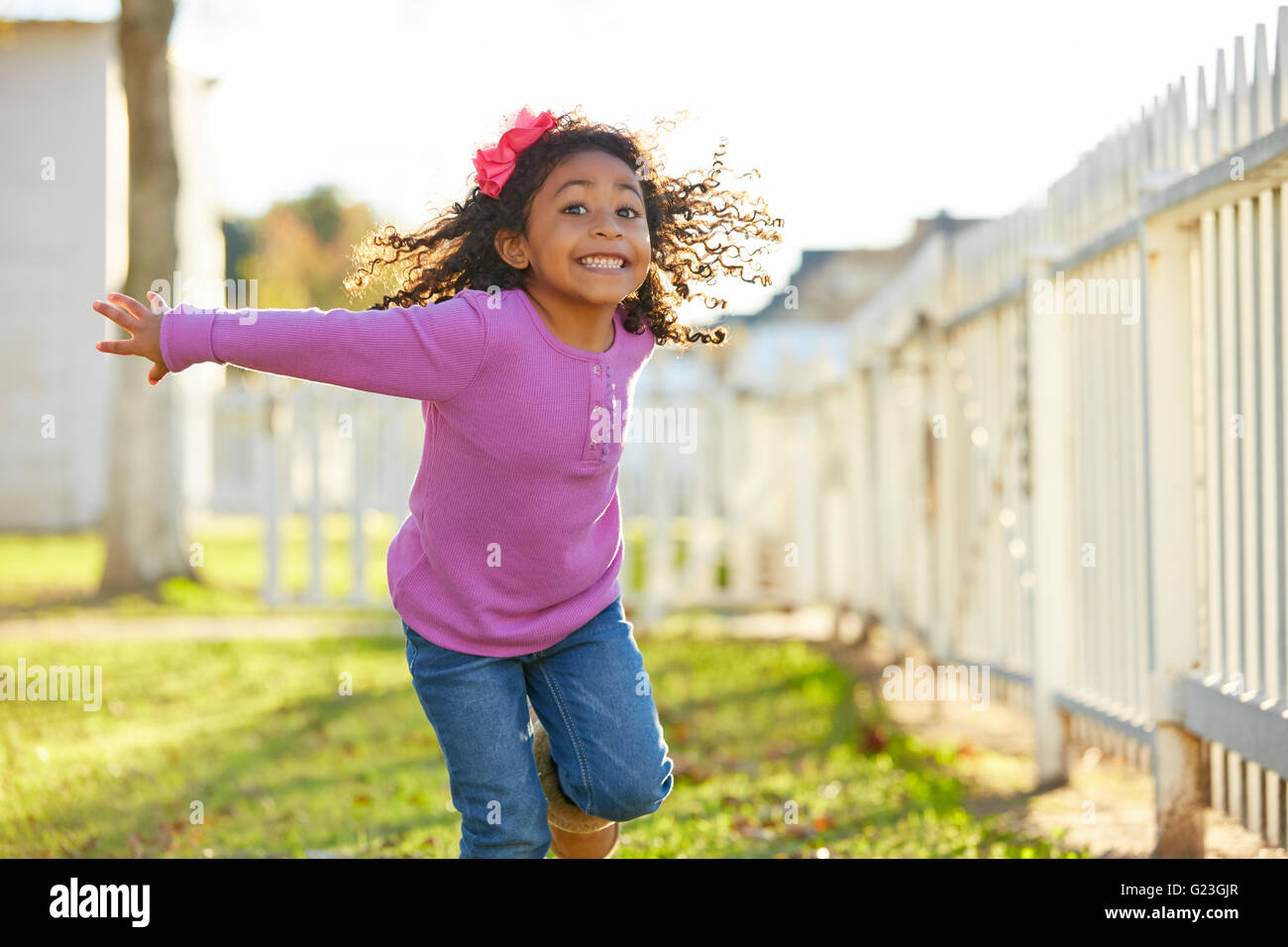 kid girl toddler playing running in park outdoor latin ethnicity Stock ...