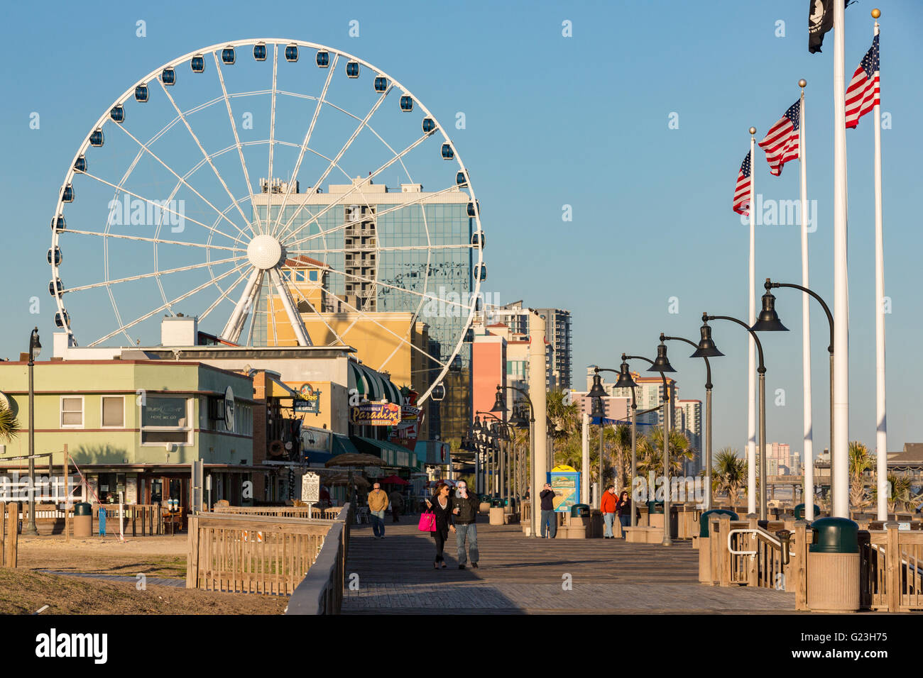 Oceanfront skyline of the boardwalk and Skywheel along the beach in ...