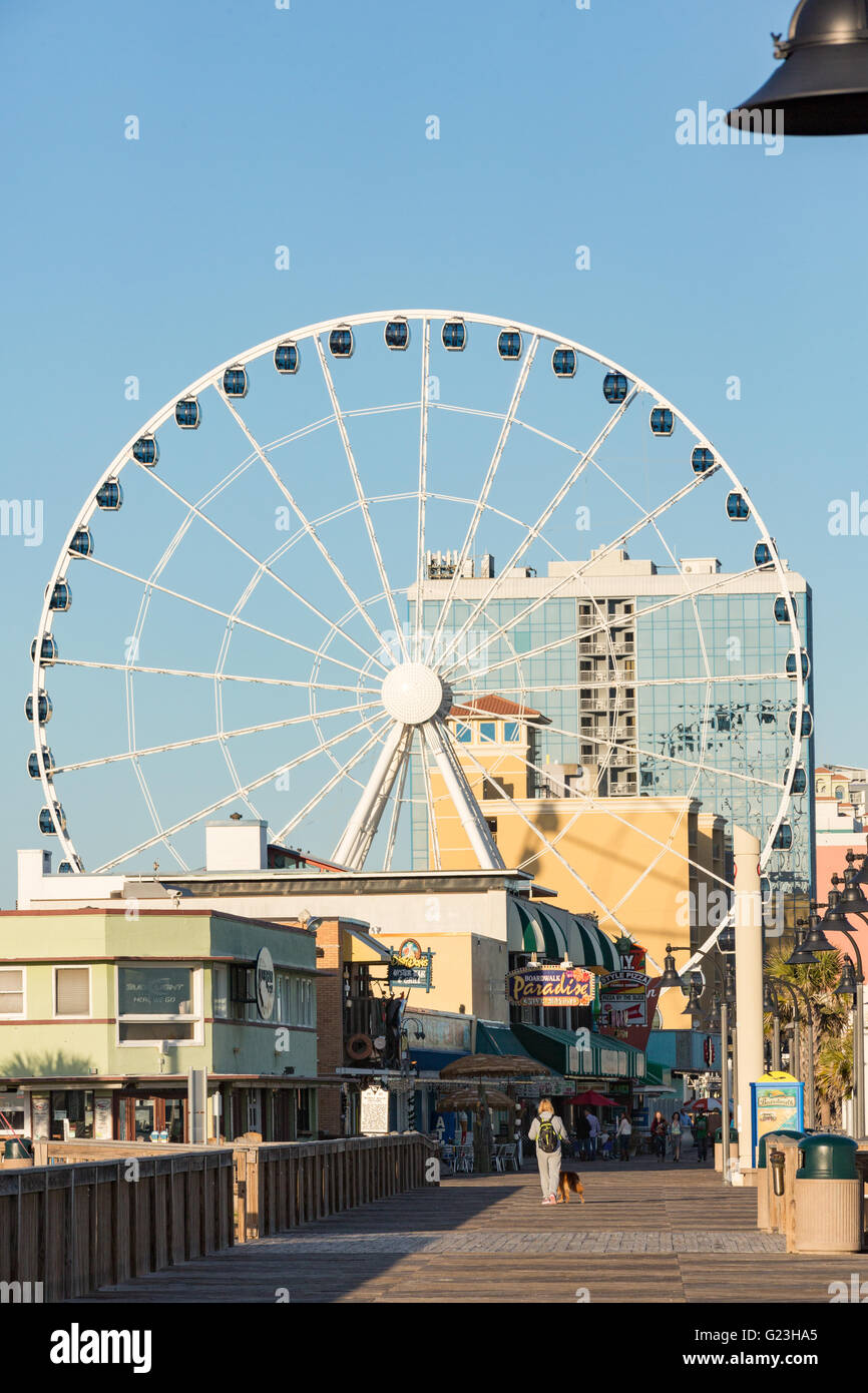 Oceanfront skyline of the boardwalk and Skywheel along the beach in ...