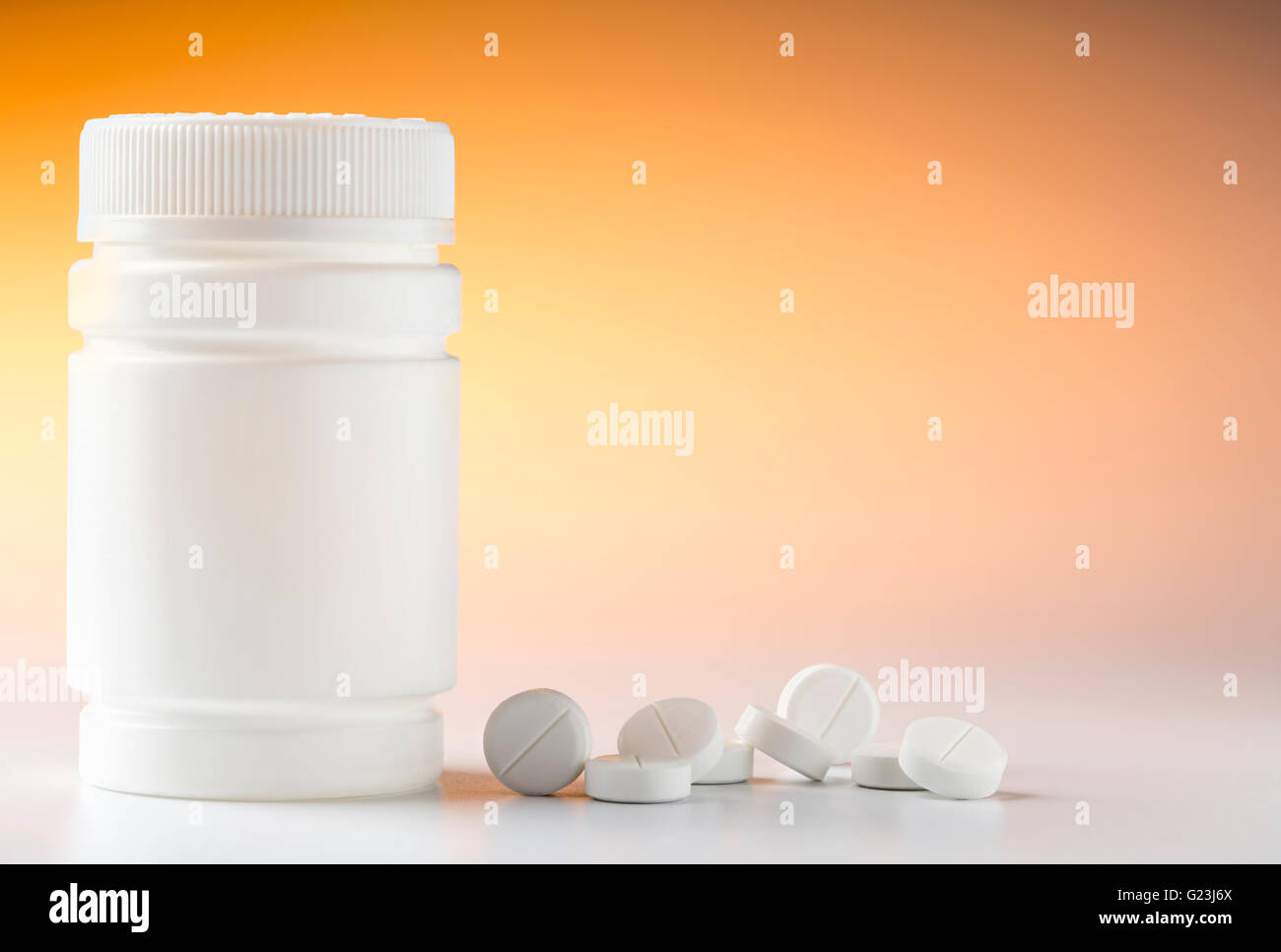 Medicine bottle and various round pills and drugs for pharmacological ...