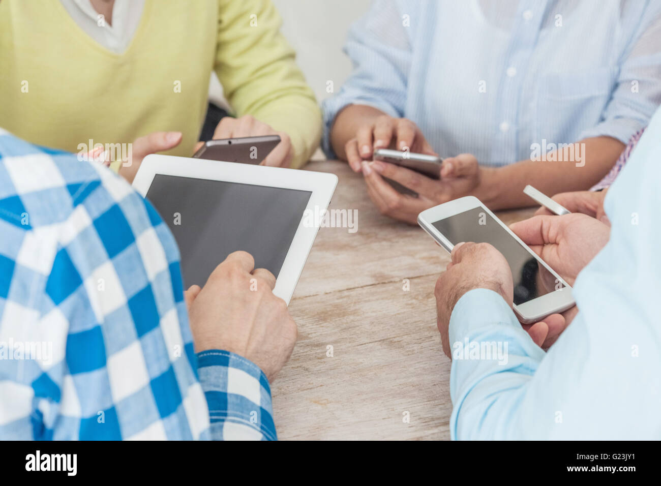 Group of diverse people using digital devices Stock Photo - Alamy