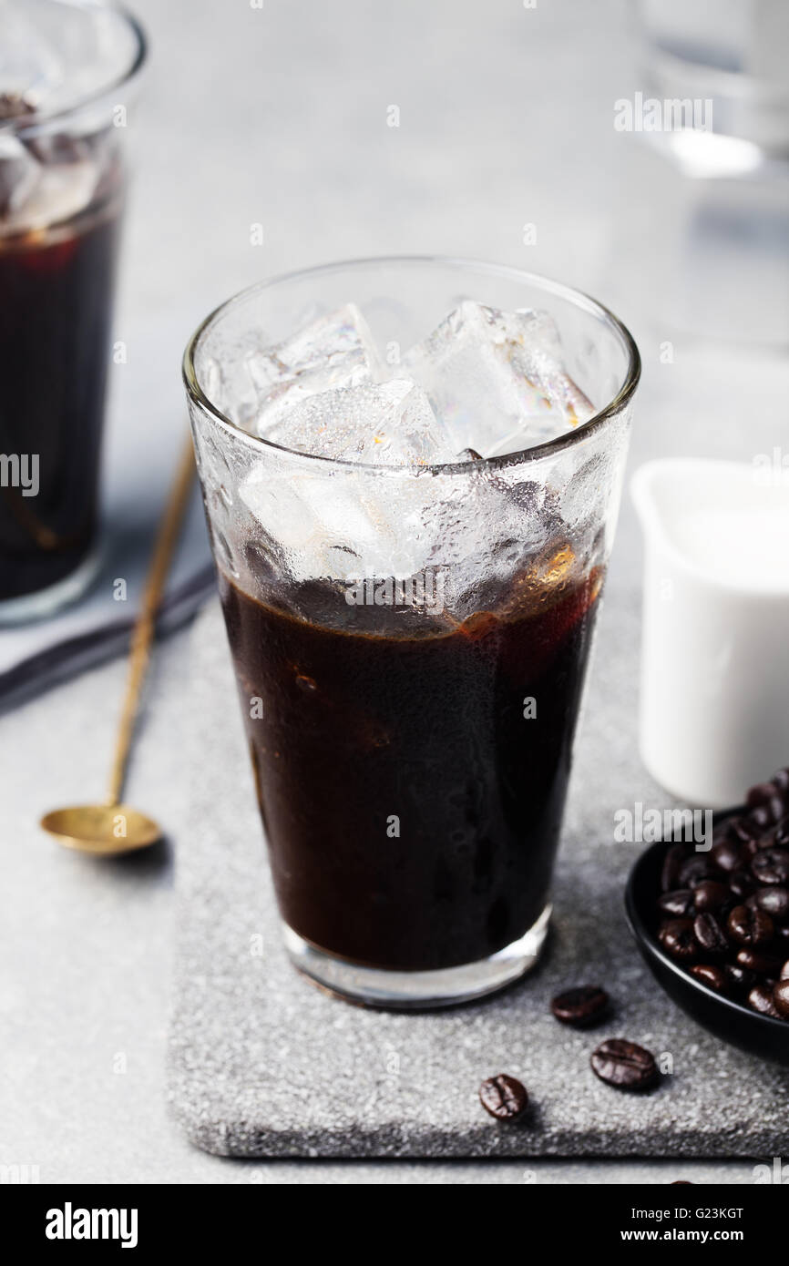 Ice coffee in a tall glass and coffee beans Stock Photo - Alamy