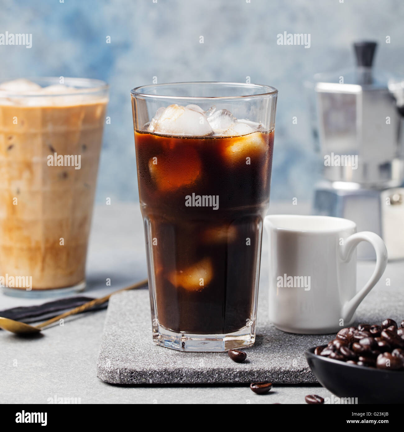 Ice coffee in a tall glass and coffee beans Stock Photo - Alamy