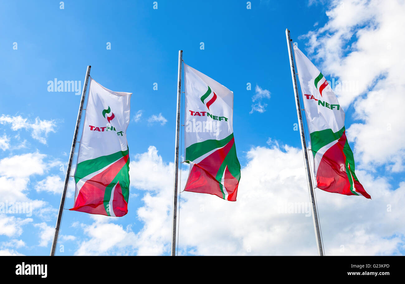 The flags of oil company Tatneft against the blue sky. Tatneft is one ...