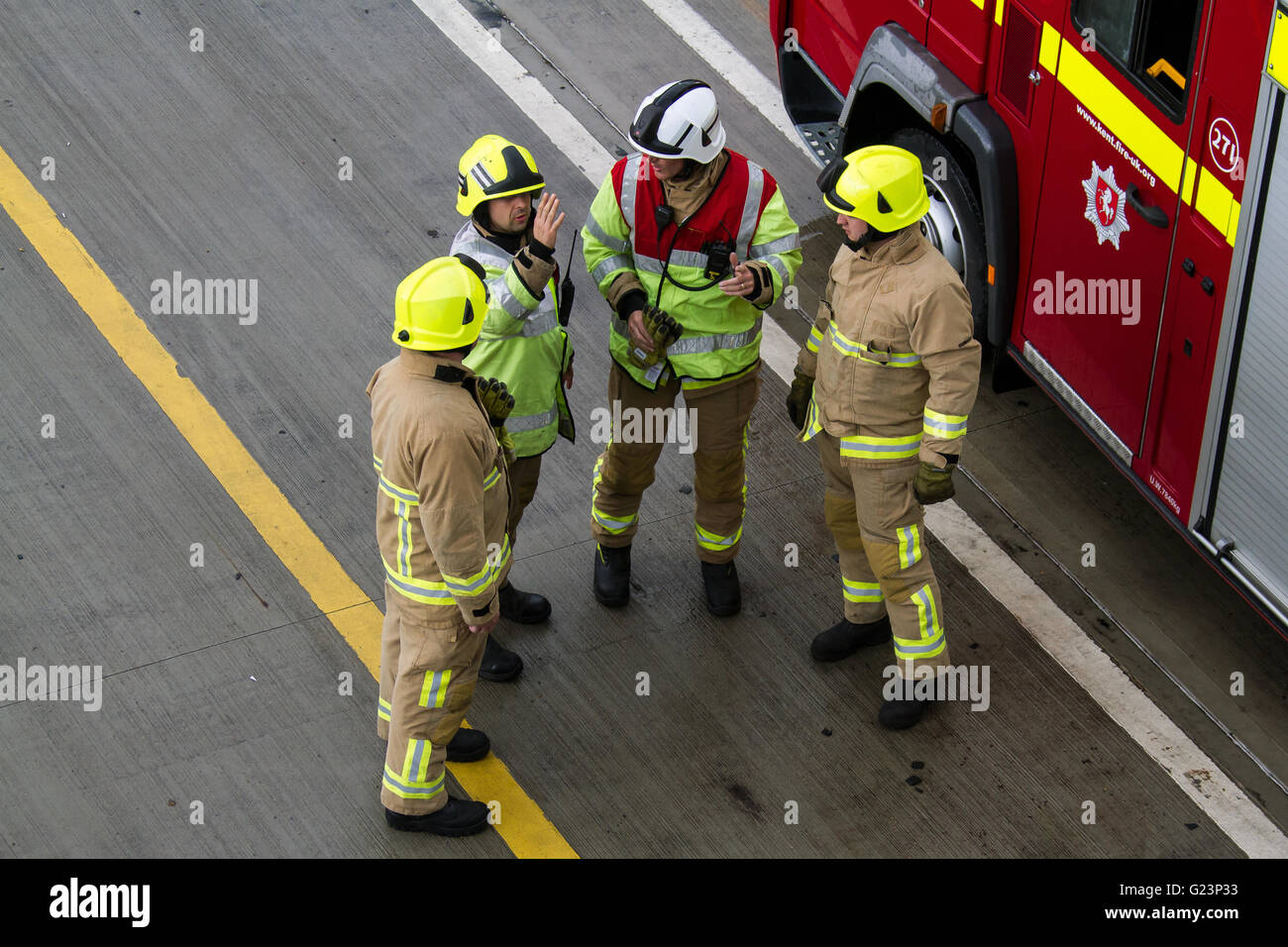 Fire officers discuss tactics during a simulated chemical incident ...