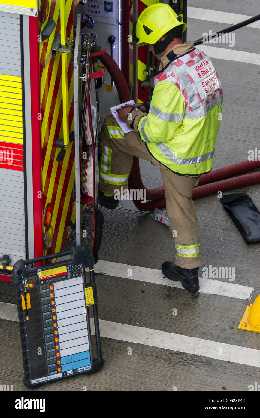 Firefighter operating a pump during a training exercise in Kent Stock ...