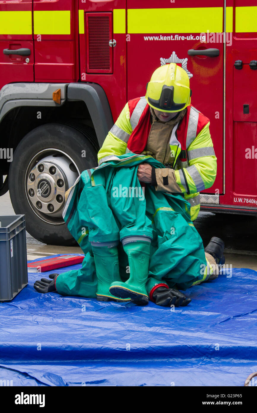 Firefighter prepares a Gas Tight Suit during a chemical incident ...