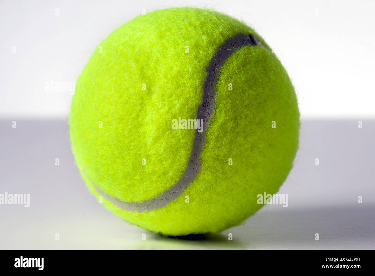 Tennis ball close up shot on a white background Stock Photo - Alamy