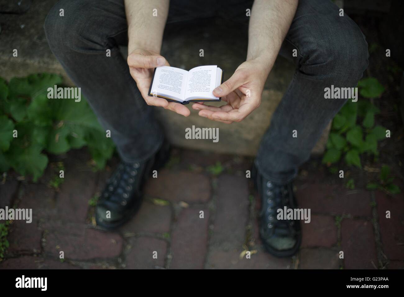 Man holding open book hi-res stock photography and images - Alamy