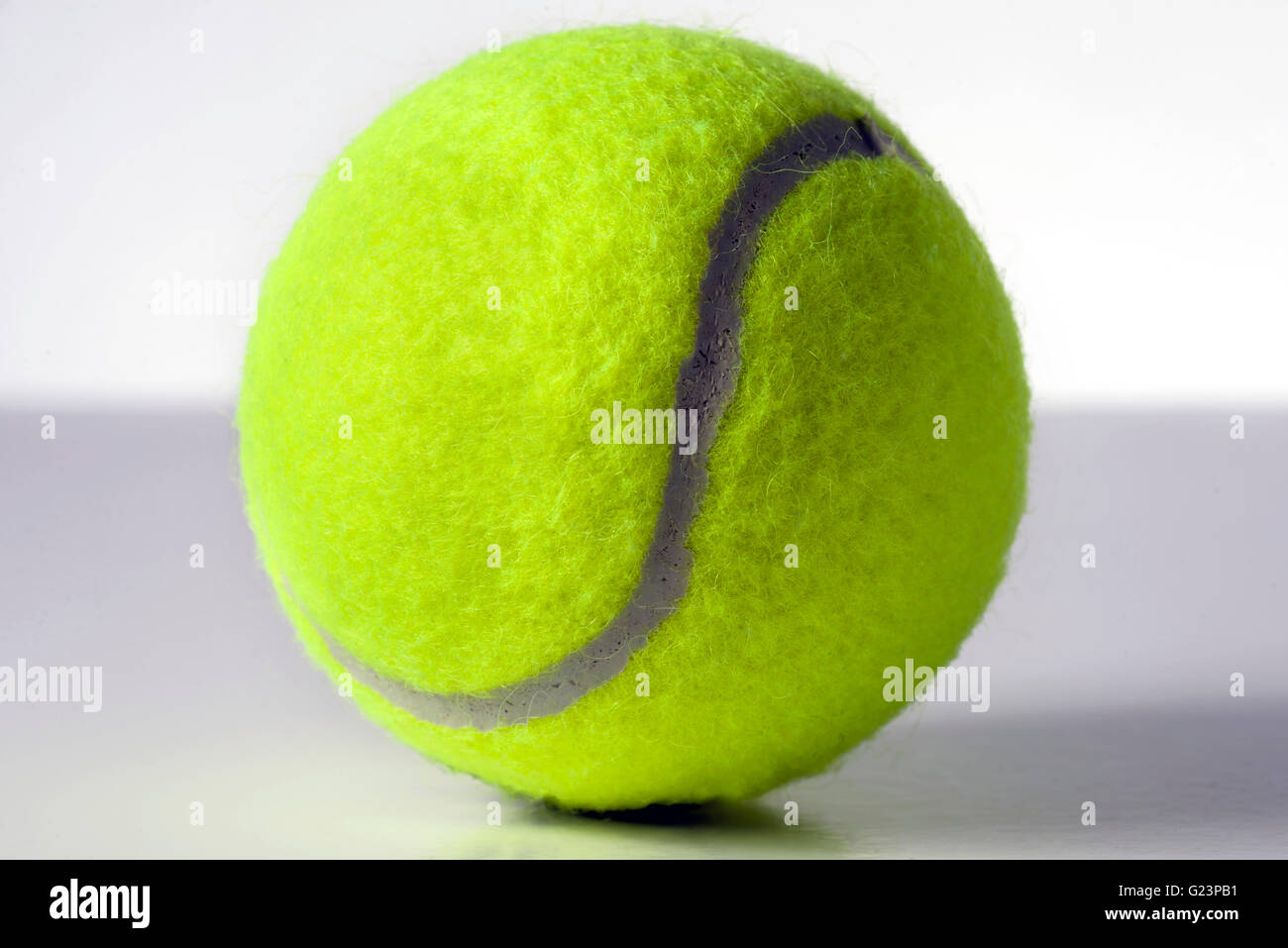Tennis ball close up shot on a white background Stock Photo - Alamy