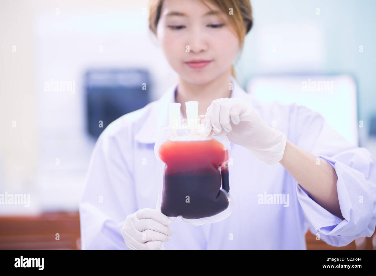 Bag of Blood in hand asian woman Doctor Stock Photo - Alamy