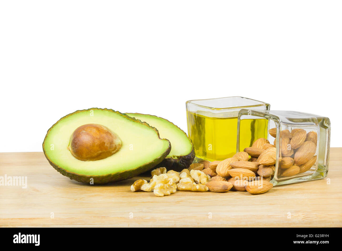 Healthy good fats with avocado, dry fruits and oil Stock Photo - Alamy