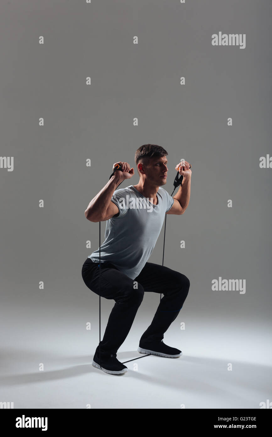 Man squatting gym hi-res stock photography and images - Alamy