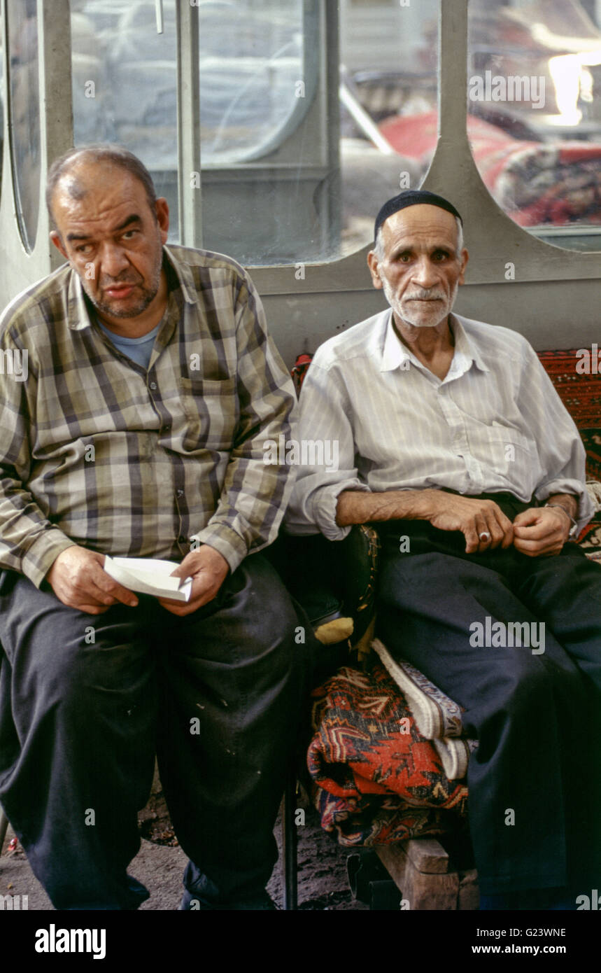Two elderly Iranian men resting in the Tehran bazaar Stock Photo - Alamy