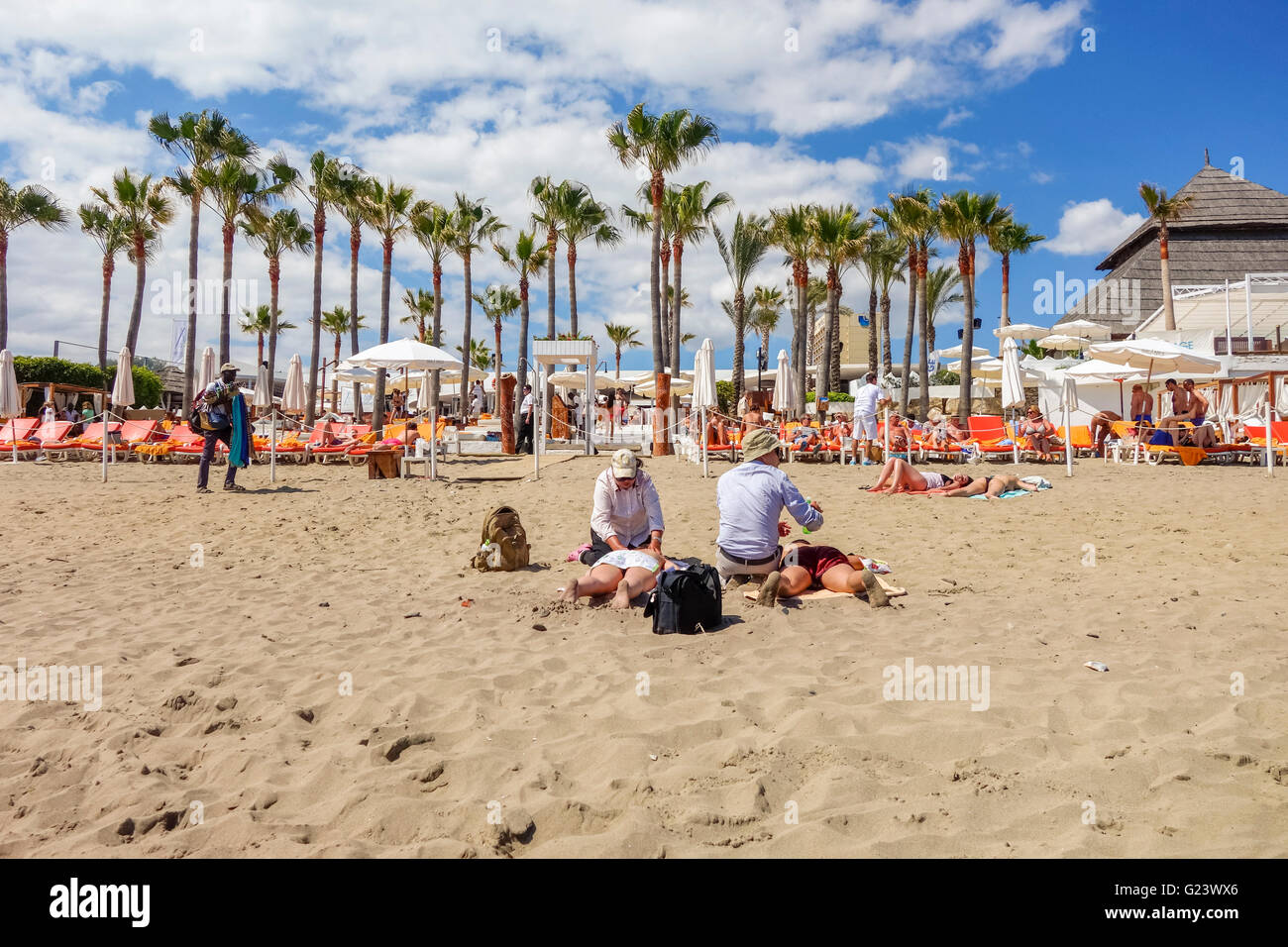 Two people having a massage in front of Nikki Beach Club, Elviria ...