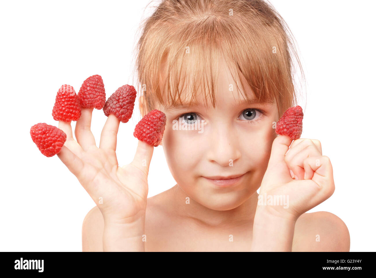 Raspberry on fingers of a little girl isolated on white Stock Photo - Alamy