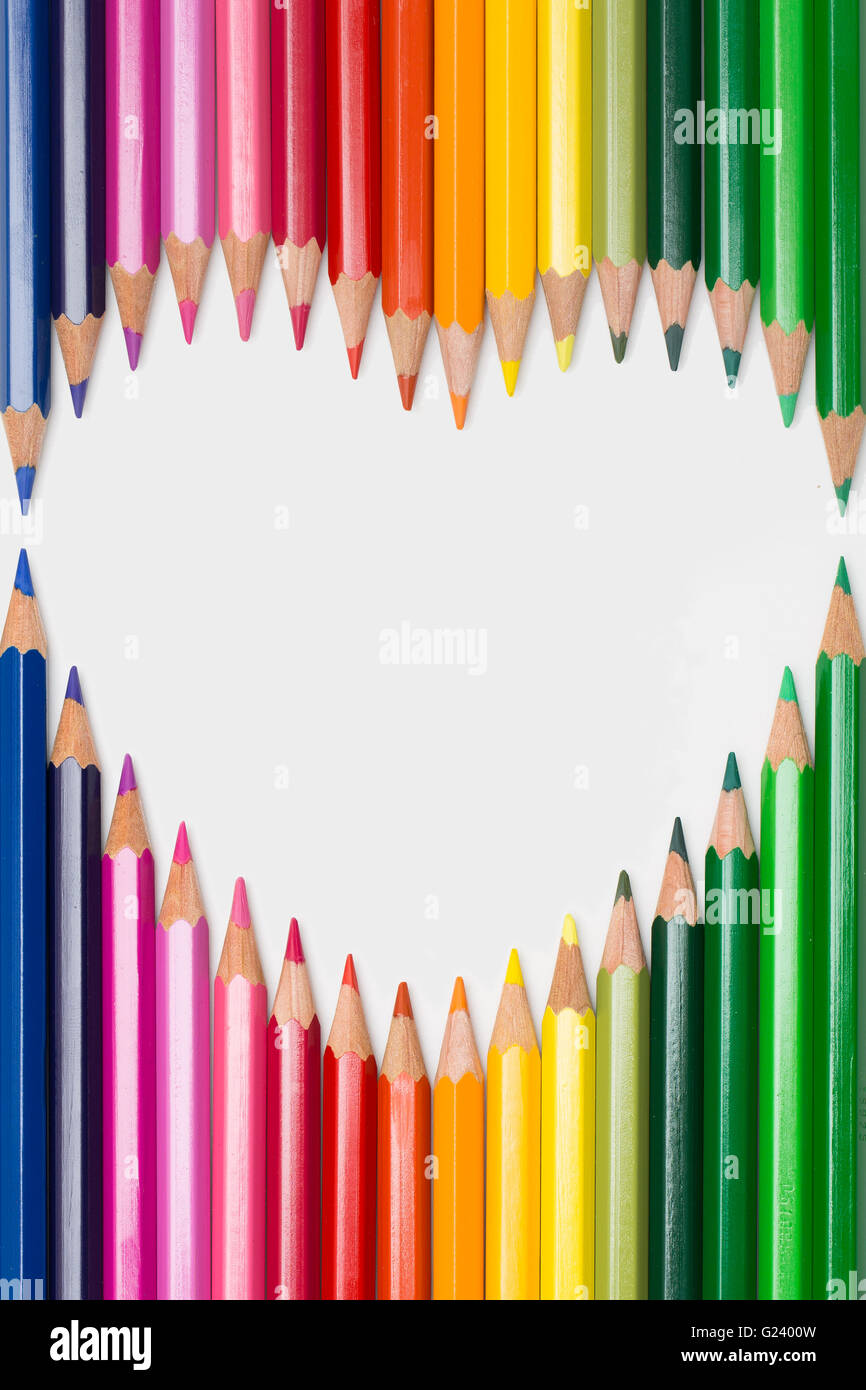 Coloured pencils in creative shape Stock Photo - Alamy