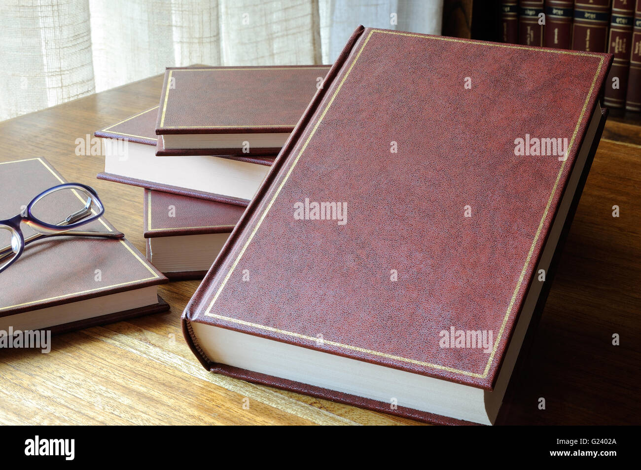 set of books set on the table, with window and library background Stock ...