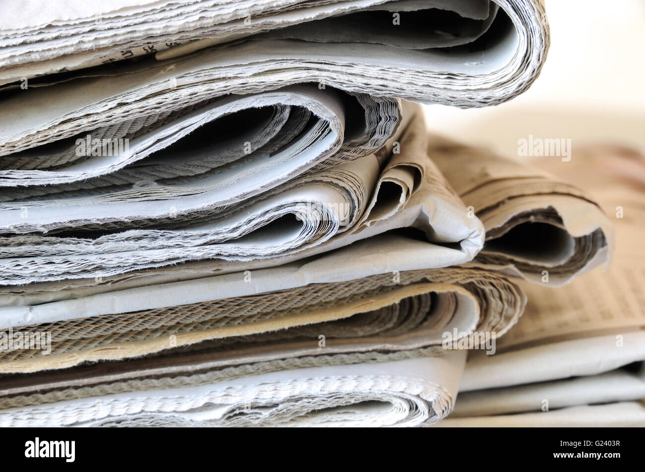 stack of folded newspapers Stock Photo - Alamy