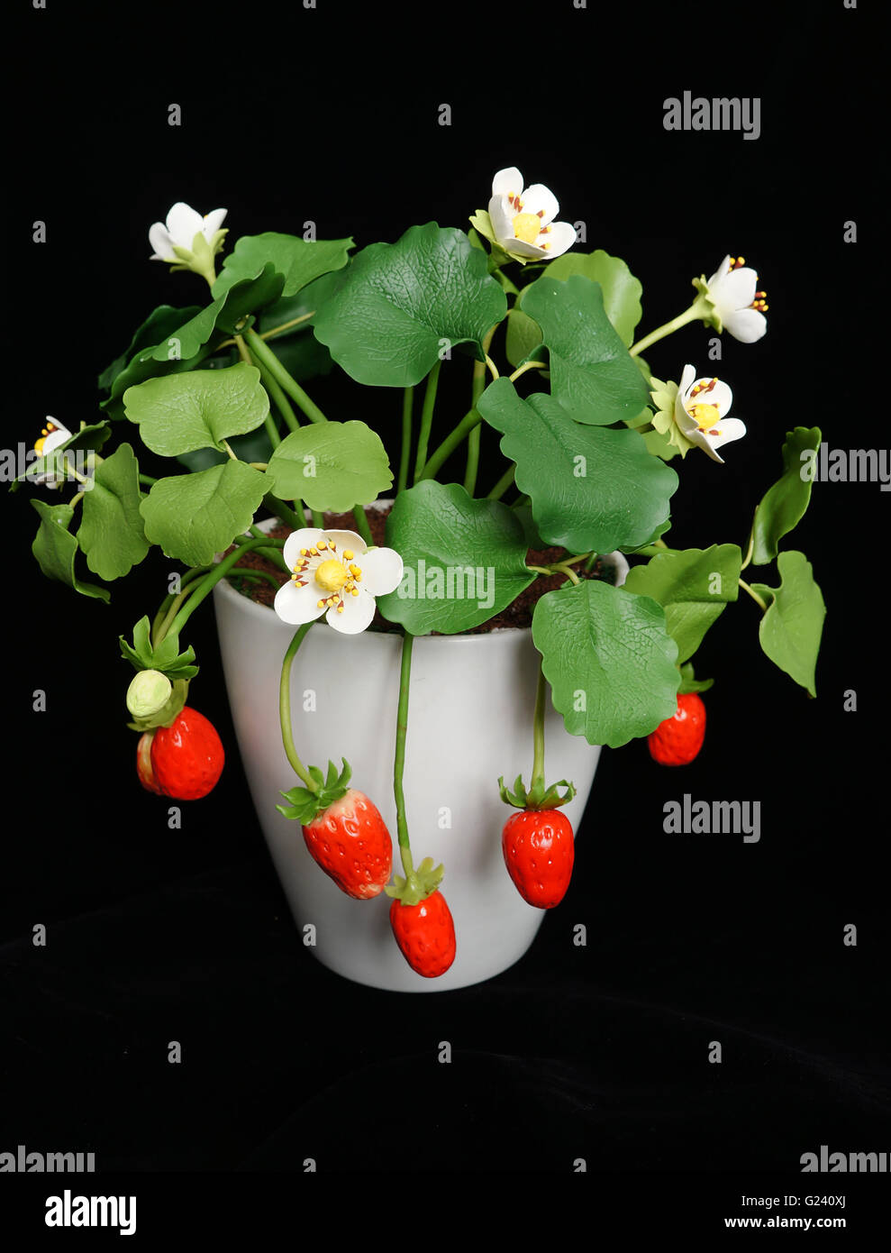 Amazing handmade product on black background, clay flower as pink lotus ...