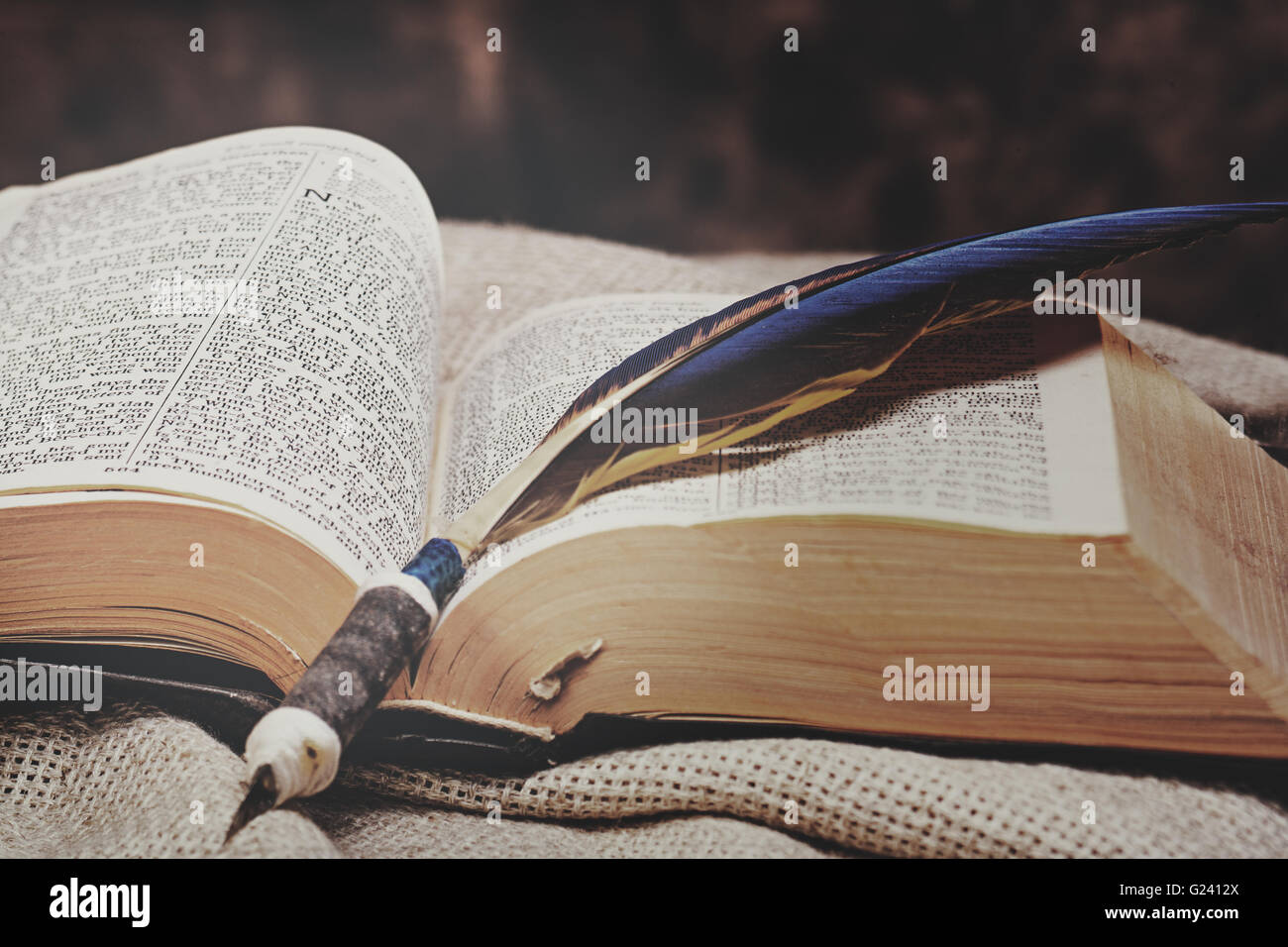 Old fashioned backgrounds with opened Holy Bible Stock Photo - Alamy