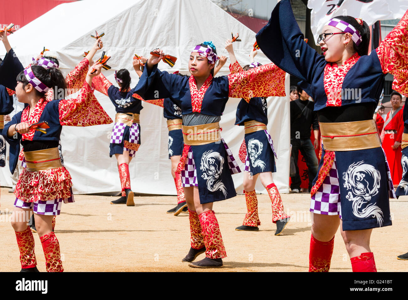 Japanese Hinokuni Yosakoi dance festival. Rows of young teenage girls ...