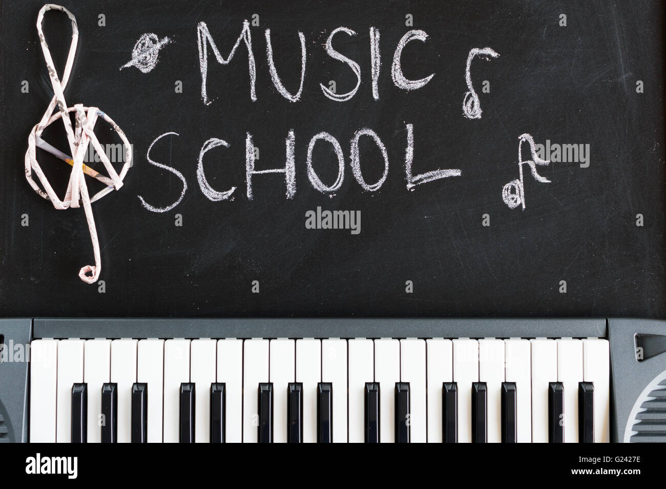 Music keyboard on blackboard background for music school children with ...