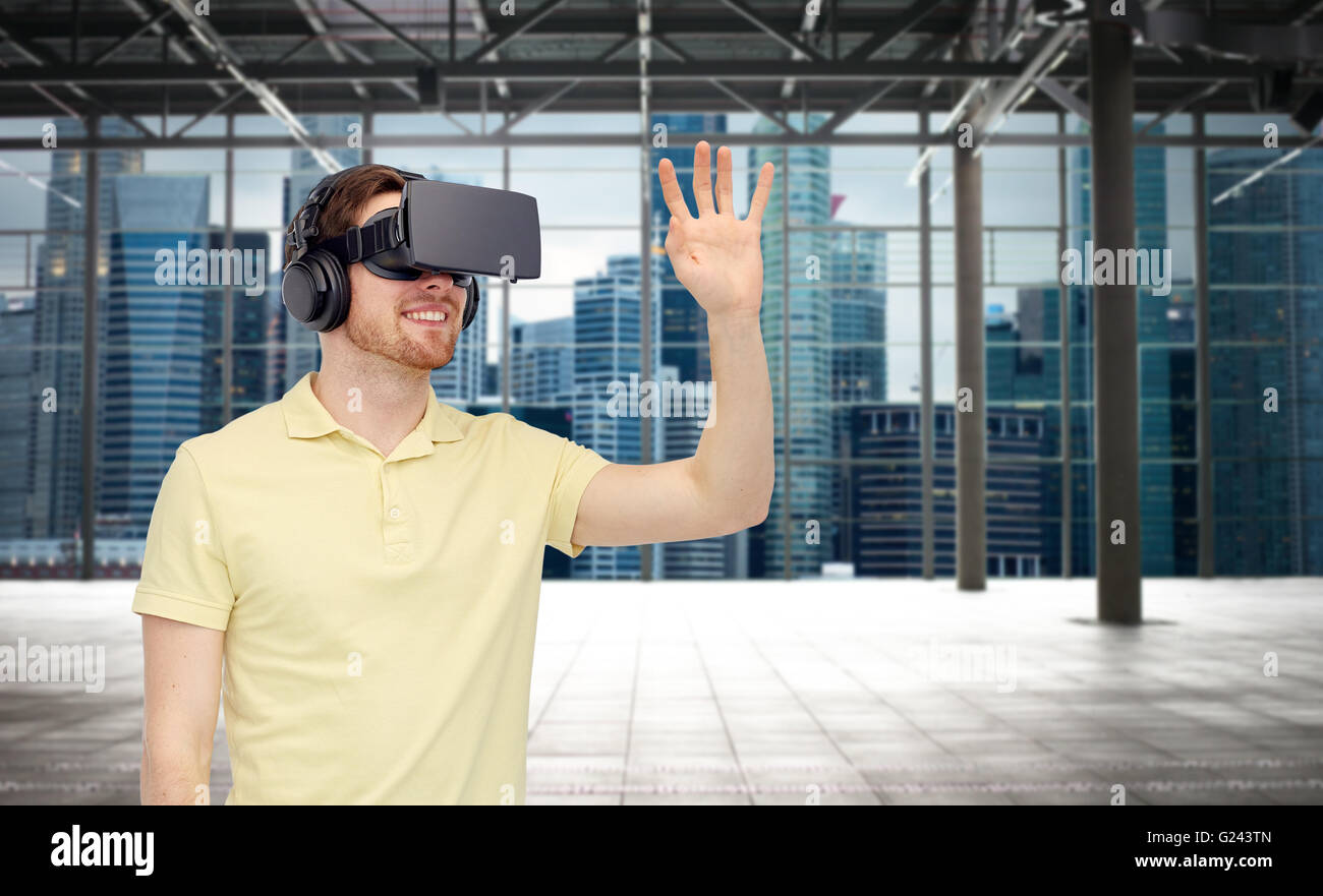 happy man in virtual reality headset or 3d glasses Stock Photo - Alamy