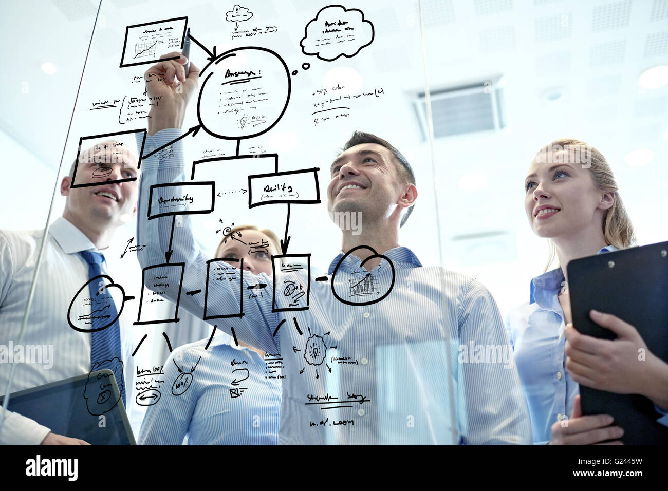 smiling business people with marker and stickers Stock Photo - Alamy