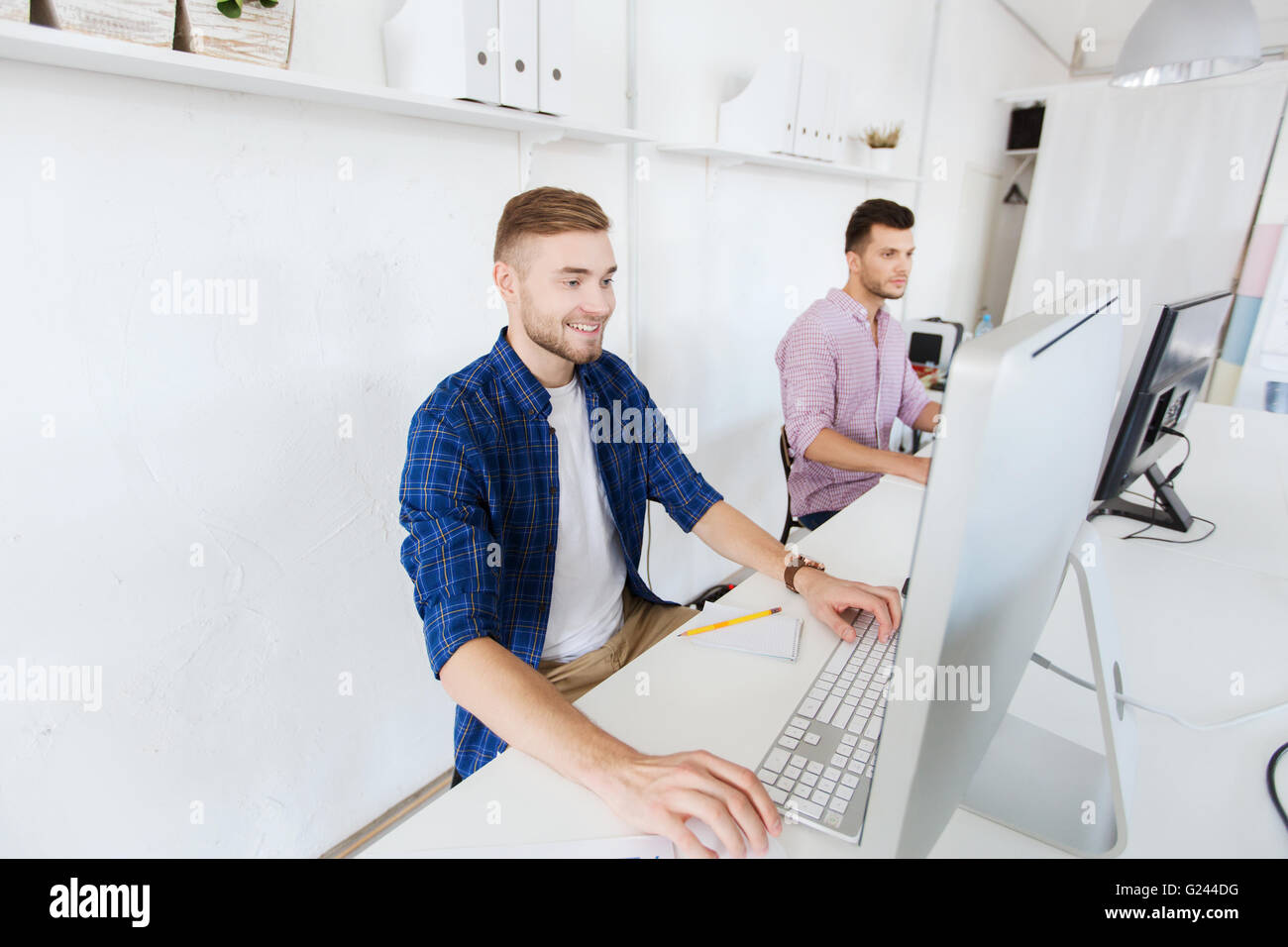 creative man or student with computer at office Stock Photo - Alamy