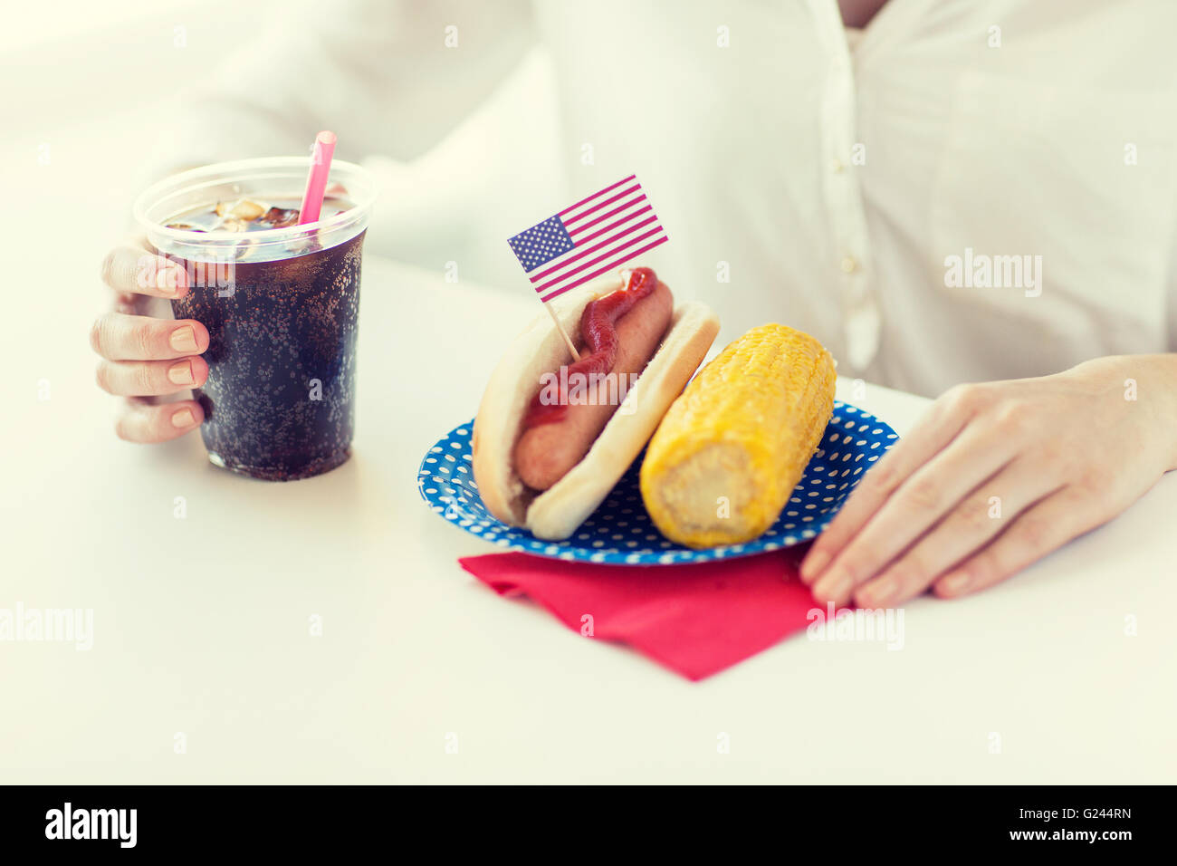 Woman eating corn dog hi-res stock photography and images - Alamy
