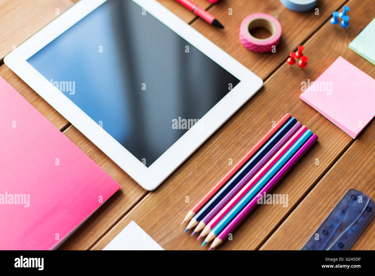 close up of school supplies and tablet pc Stock Photo - Alamy