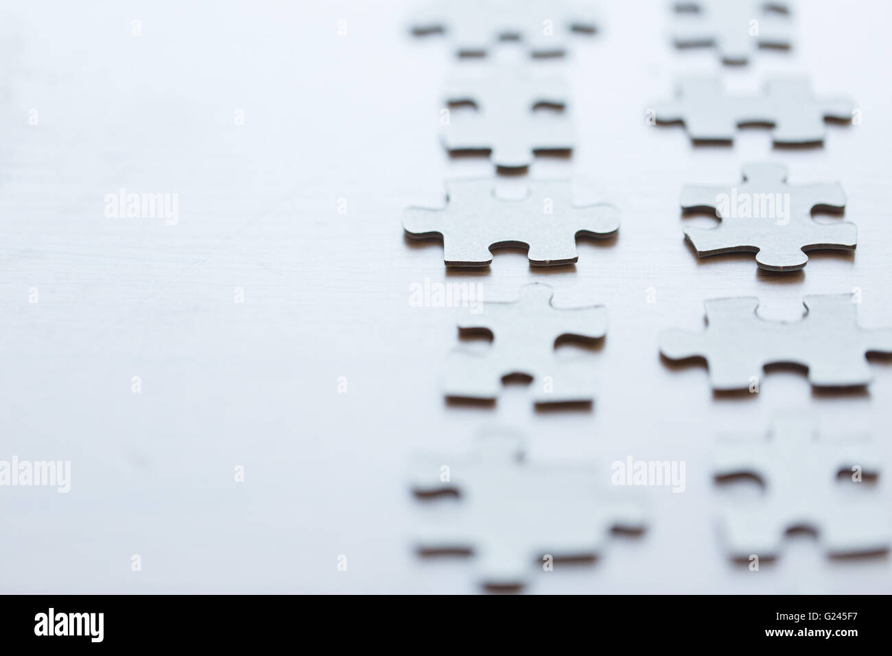 close up of puzzle pieces on table Stock Photo - Alamy